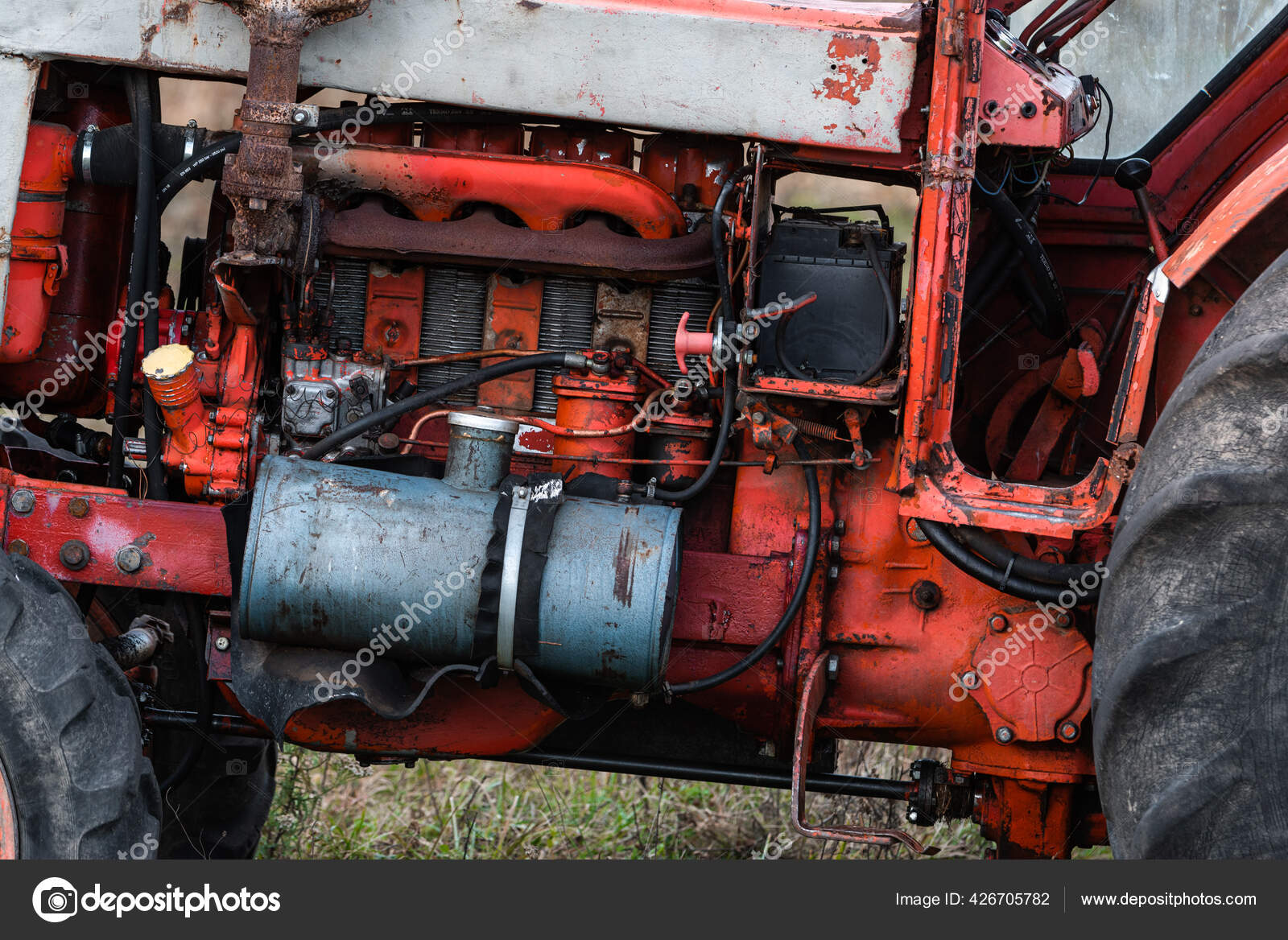 Old silver painted diesel tank on red vintage russian tractor engine ...