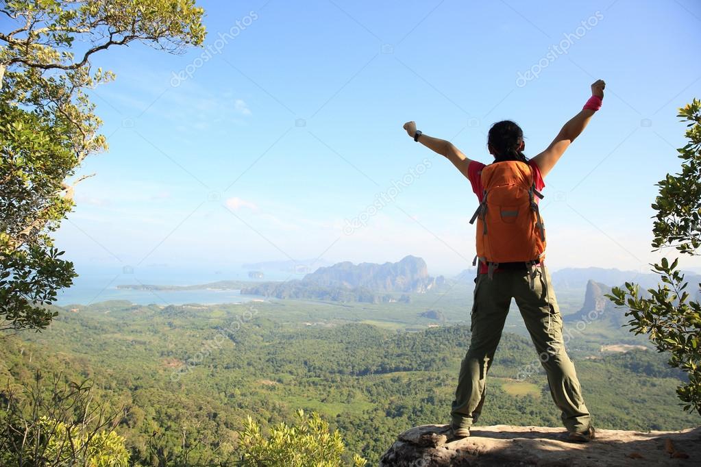 Cheering woman hiker Stock Photo by ©lzf 110880874