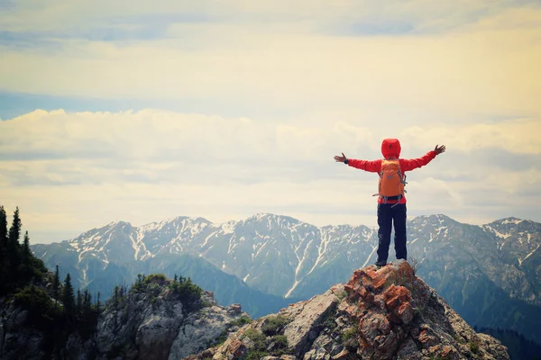 Cheering woman hiker open arms - Stock Image - Everypixel