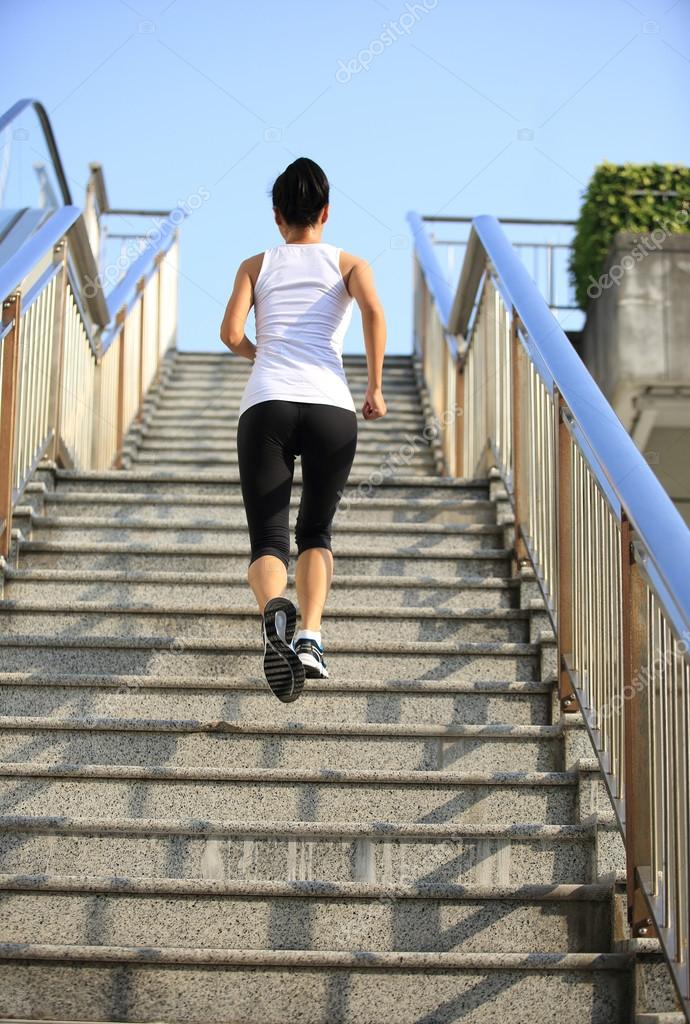 Runner athlete running on stairs Stock Photo by ©lzf 56473331