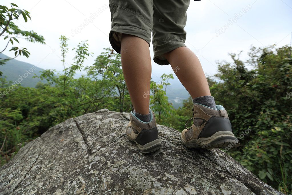 Woman hiker legs at mountain Stock Photo by ©lzf 72032191