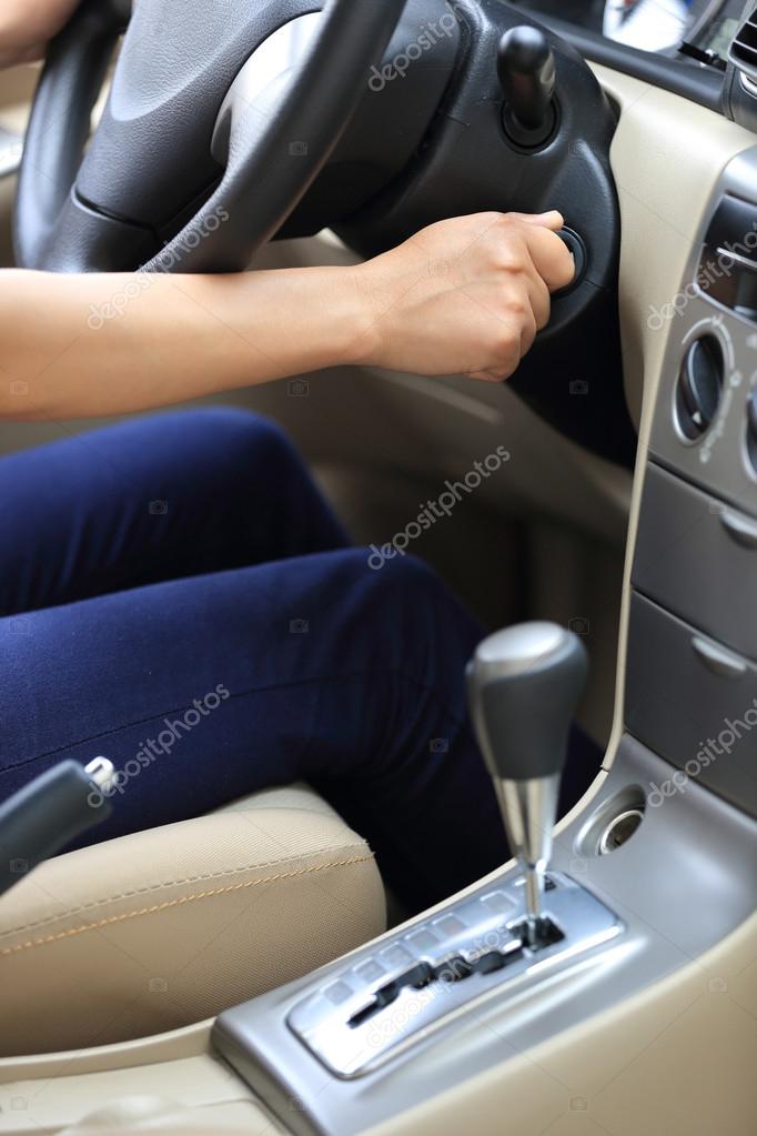 Woman driver starting car — Stock Photo © lzf #72810959