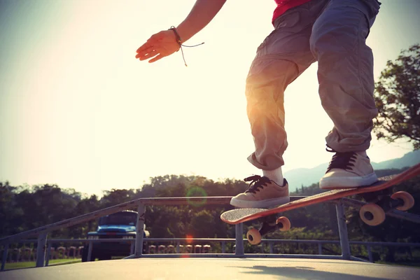 Skateboarder legs doing ollie - Stock Image - Everypixel