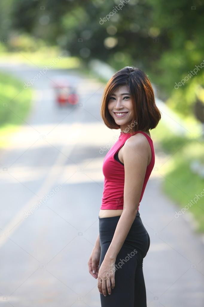 Pretty women standing poses, smile down hill background — Stock Photo ...