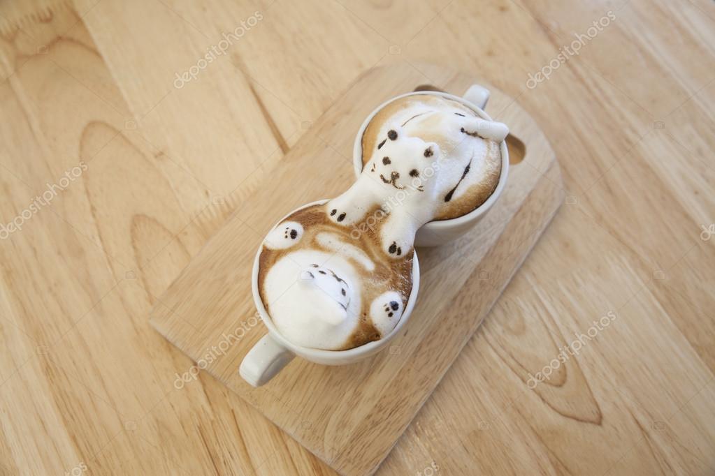 Top view of latte coffee topping made by milk foam top on the cup of ...