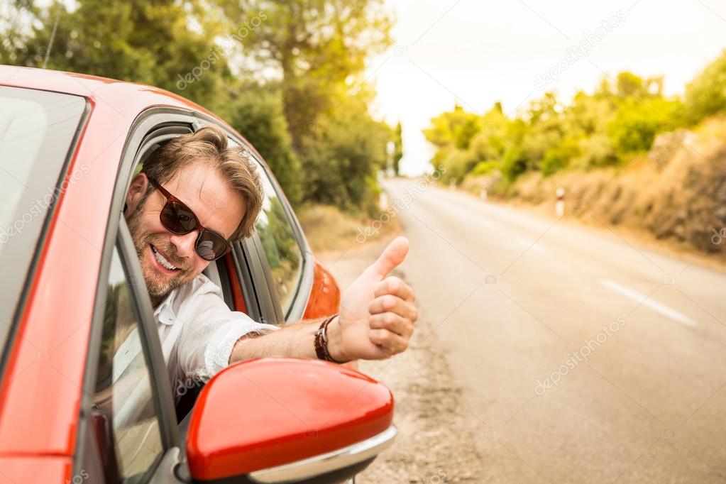 Driver in a car showing thumbs up gesture Stock Photo by ©Pinkyone ...