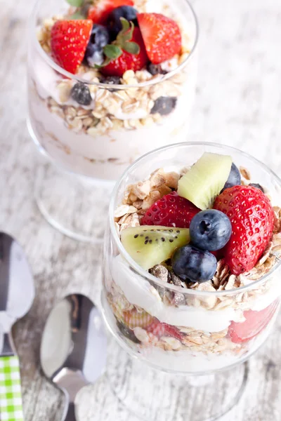 Muesli with yogurt and fruits — Stock Photo © Bernashafo #66754967