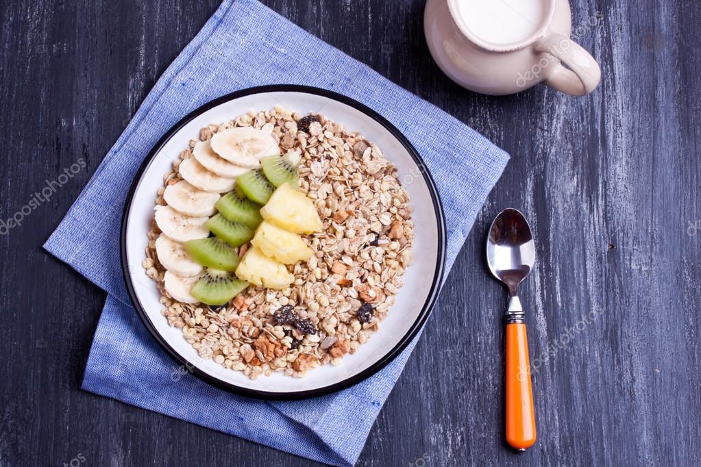 Muesli with fruit and milk Stock Photo by ©Bernashafo 82864234