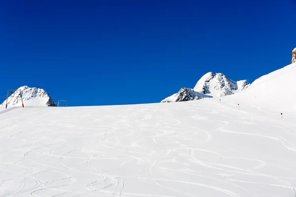 Fresh ski tracks on ski slope - Stock Image - Everypixel