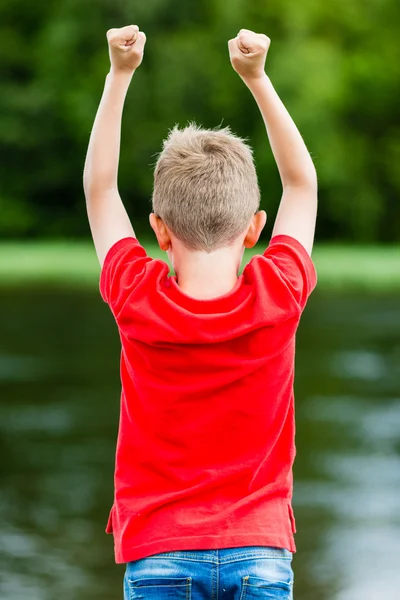 Kids with raised arms Stock Photo by ©Bigandt 51865729