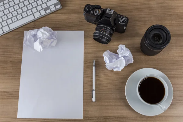 Desktop with camera blank sheet and coffee - Stock Image - Everypixel