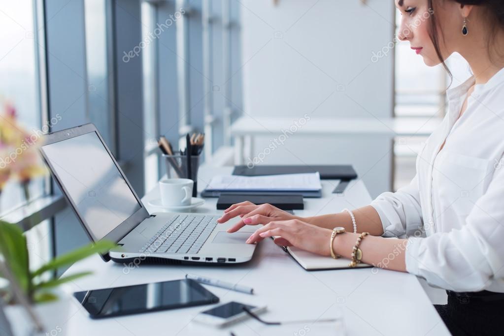 Attractive female assistant working Stock Photo by ©undrey 108870870