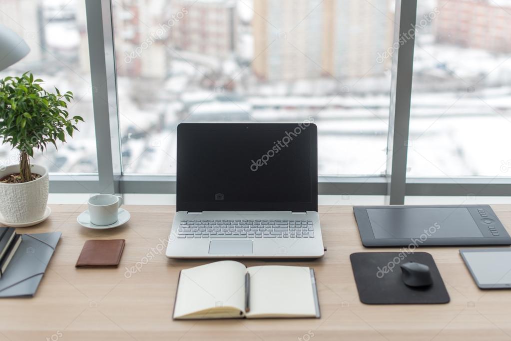Office. Comfortable work table, workplace with notebook laptop. Stock ...