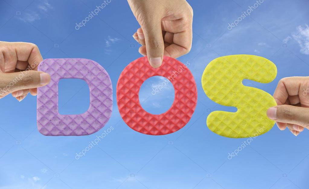 Hand arrange alphabet DOS of acronym Disk Operating System. Stock Photo ...