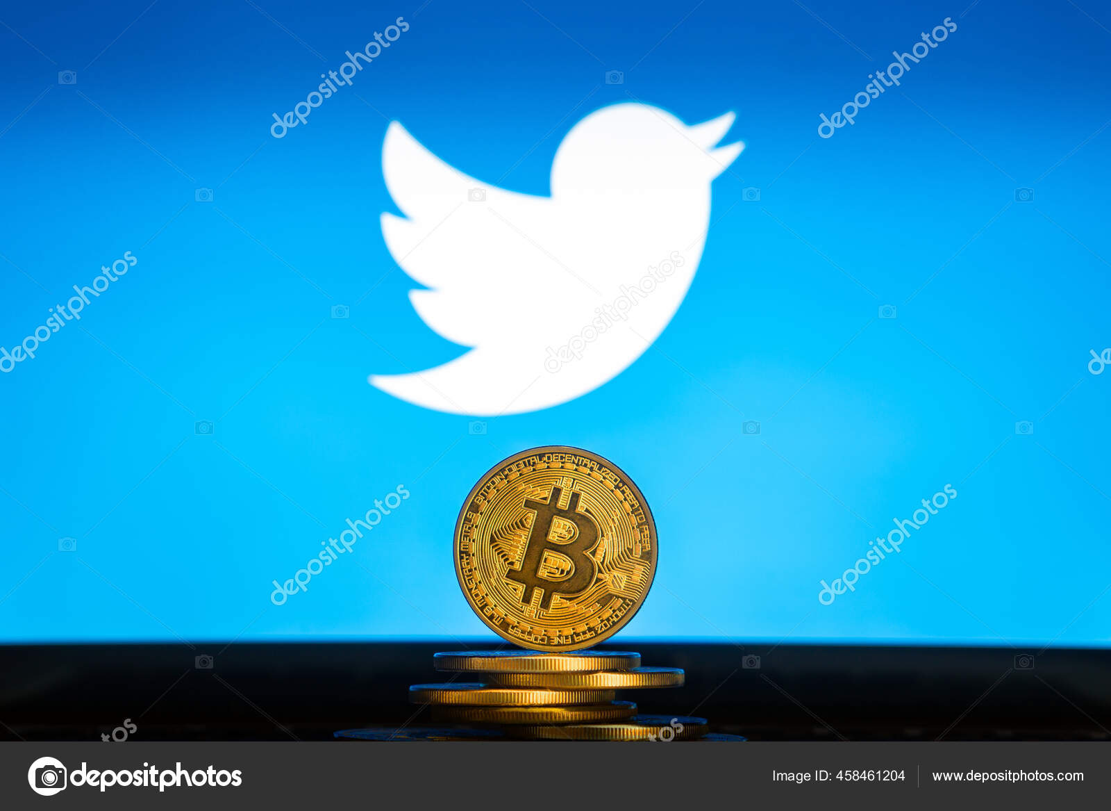 Bitcoin on a stack of coins with Twitter logo — Stock Editorial Photo ...