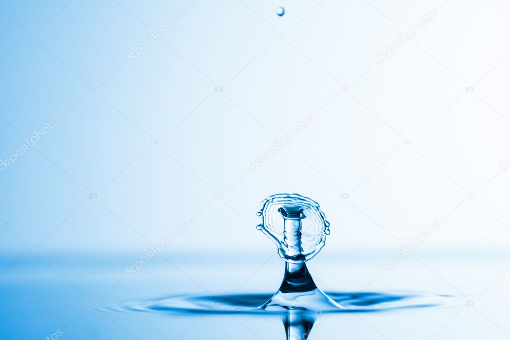 Blue water splash Stock Photo by ©Vitaly.R 68937303