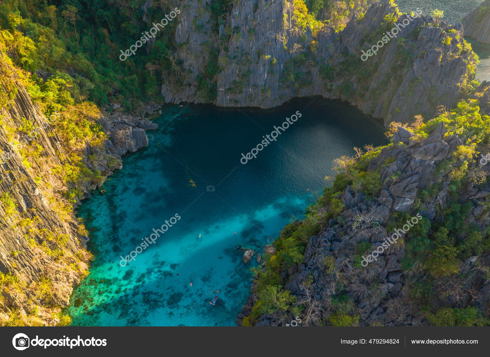 Aerial view of turquoise tropical lagoon with limestone cliffs in Coron ...