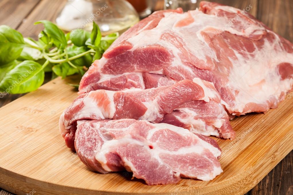 Raw pork on cutting board Stock Photo by ©fotek 53750121