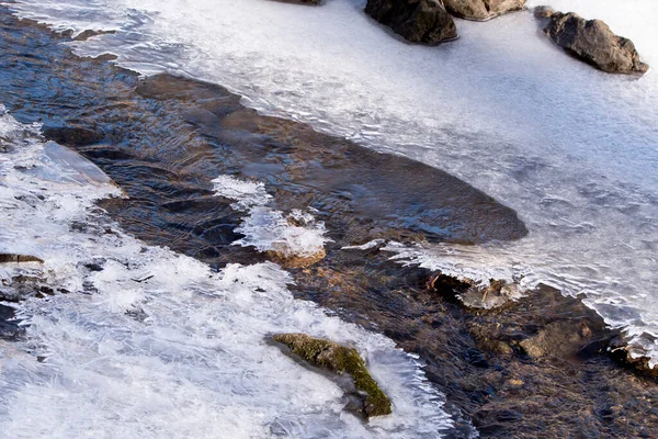 Ice splashes on frozen rocks and stones Stock Photos, Royalty Free Ice ...