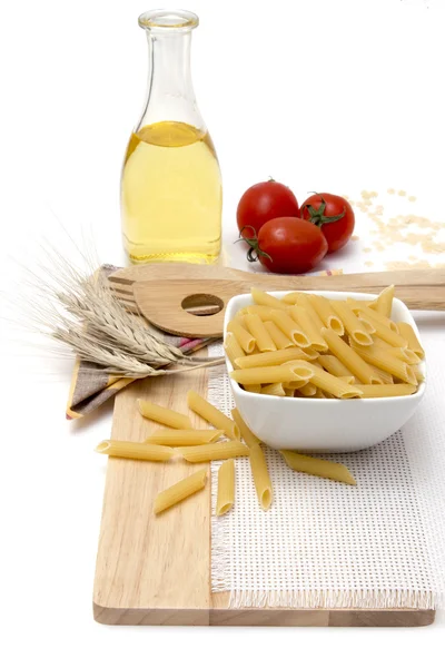 Italian pasta, macaroni quills with cherry tomatoes and olive oil in a ...