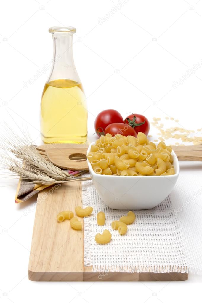 Italian pasta, macaroni quills with cherry tomatoes and olive oil in a ...