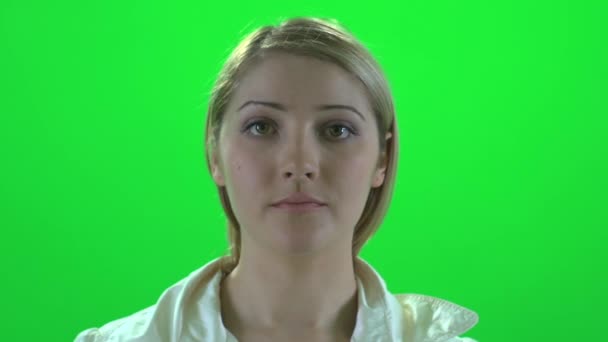 Woman facing camera — Stock Video © stockmedia #69426799