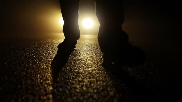 Walking feet into light beams — Stock Video © stockmedia #94780020