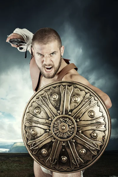 Gladiator warrior with sword and shield — Stock Photo © luislouro ...