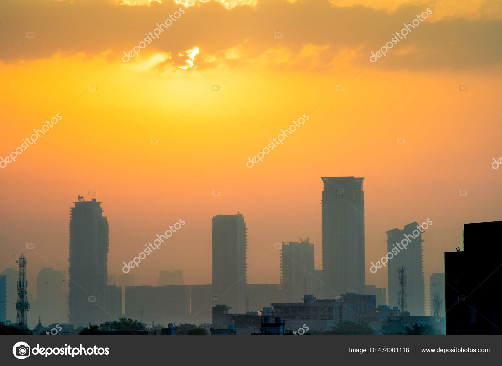 Cloudy dusk dawn shot with the sun hidden and fog obscured sky scrapers ...
