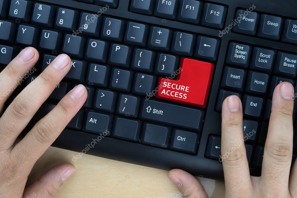 Hands on computer keyboard with "Secure Access" words at enter button ...