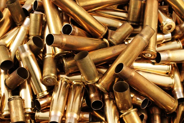 Pile of empty bullet shells Stock Photo by ©yanmingzhang 35760103
