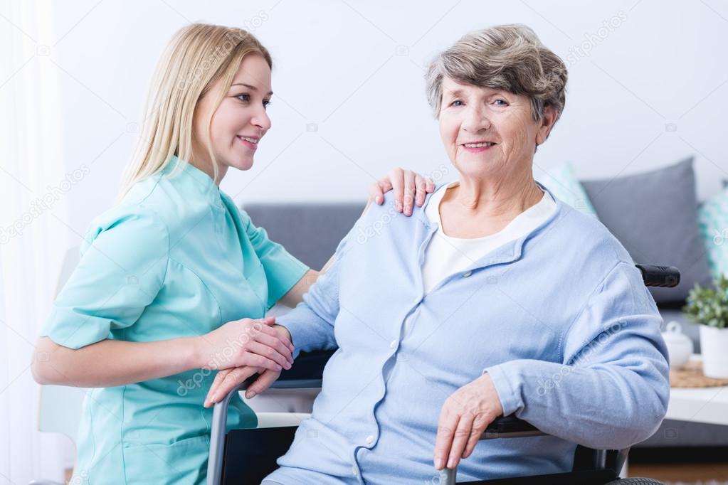 Disabled patient and carer — Stock Photo © photographee.eu #105287836