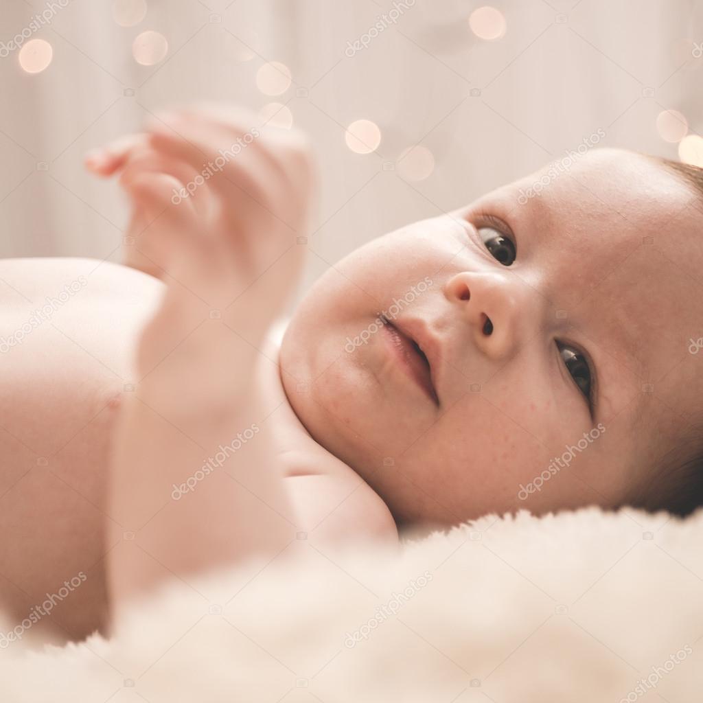 Beautiful infant raising hand Stock Photo by ©photographee.eu 109899544