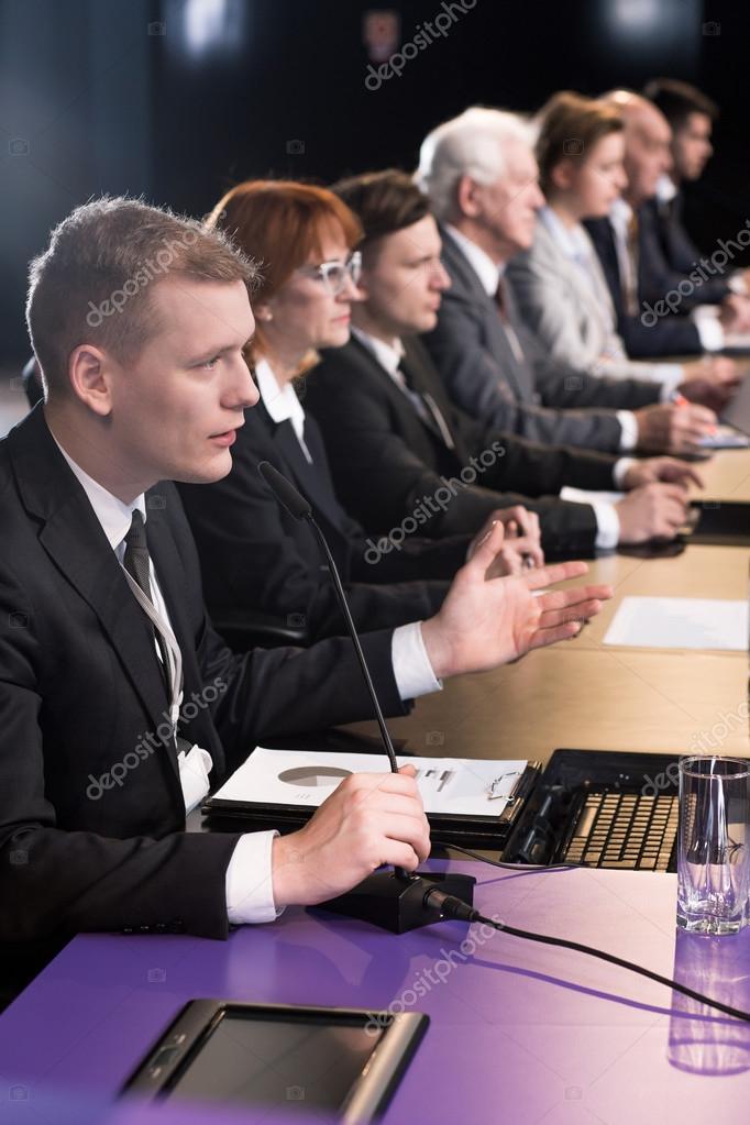 Answering tricky questions from a press journalist Stock Photo by ...