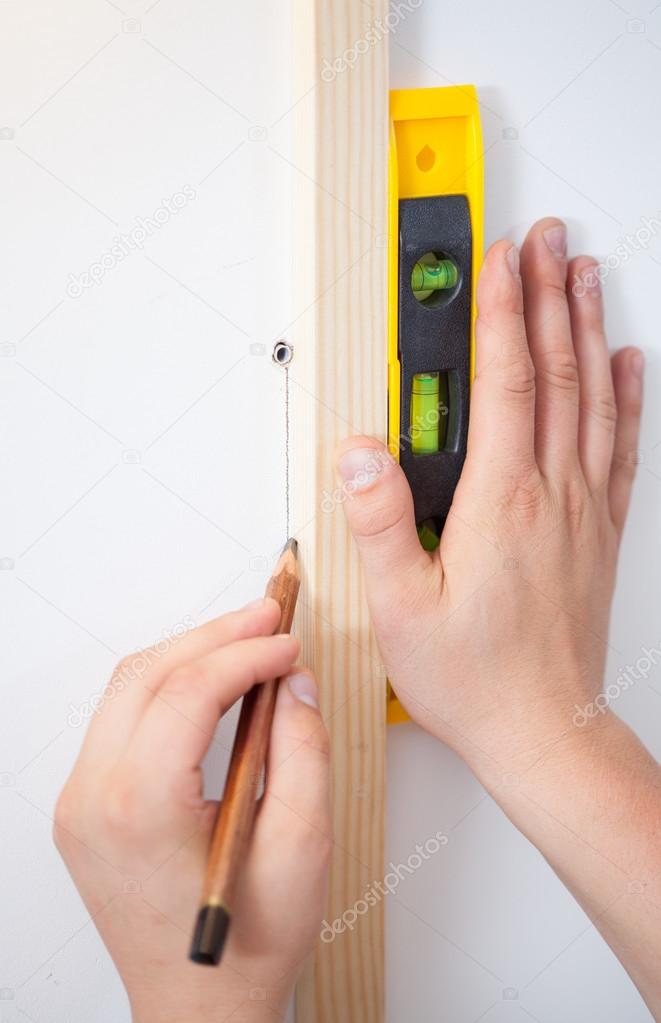 Making wall markings using a spirit level and pencil — Stock Photo ...
