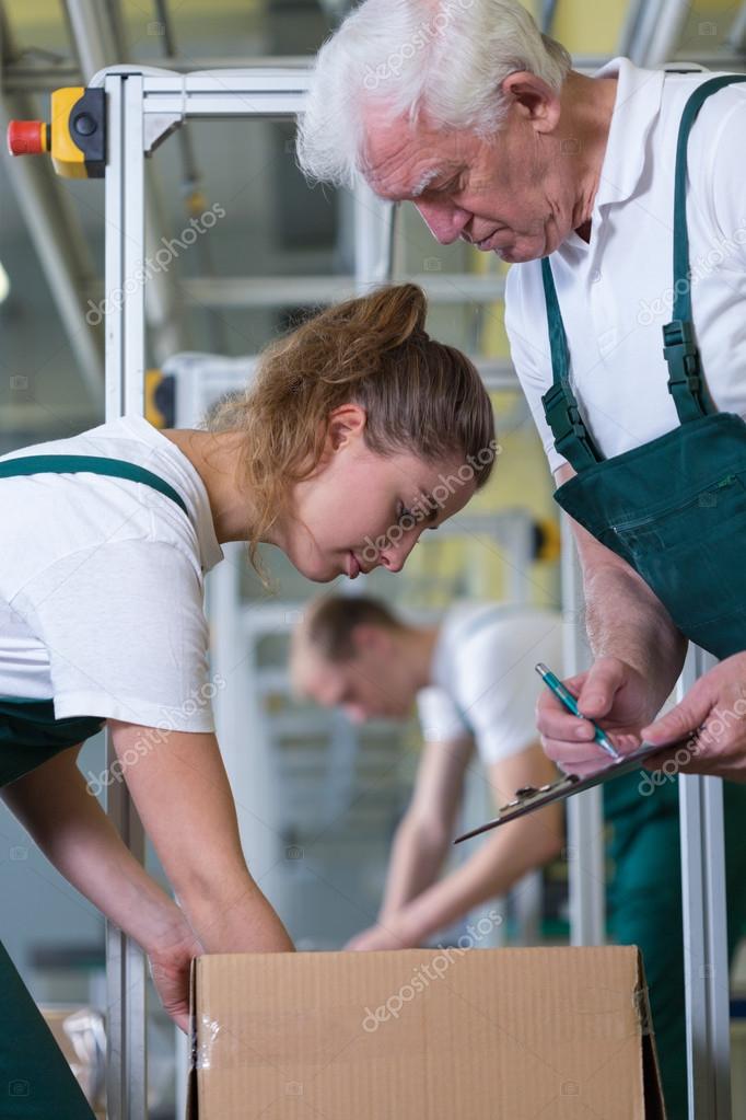 Production workers in manufacturing centre — Stock Photo © photographee ...