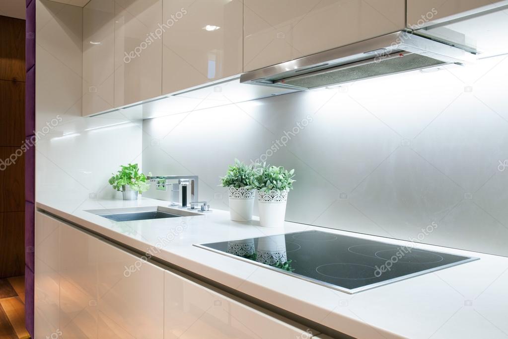 Modern kitchen with induction hob Stock Photo by ©photographee.eu 67875105