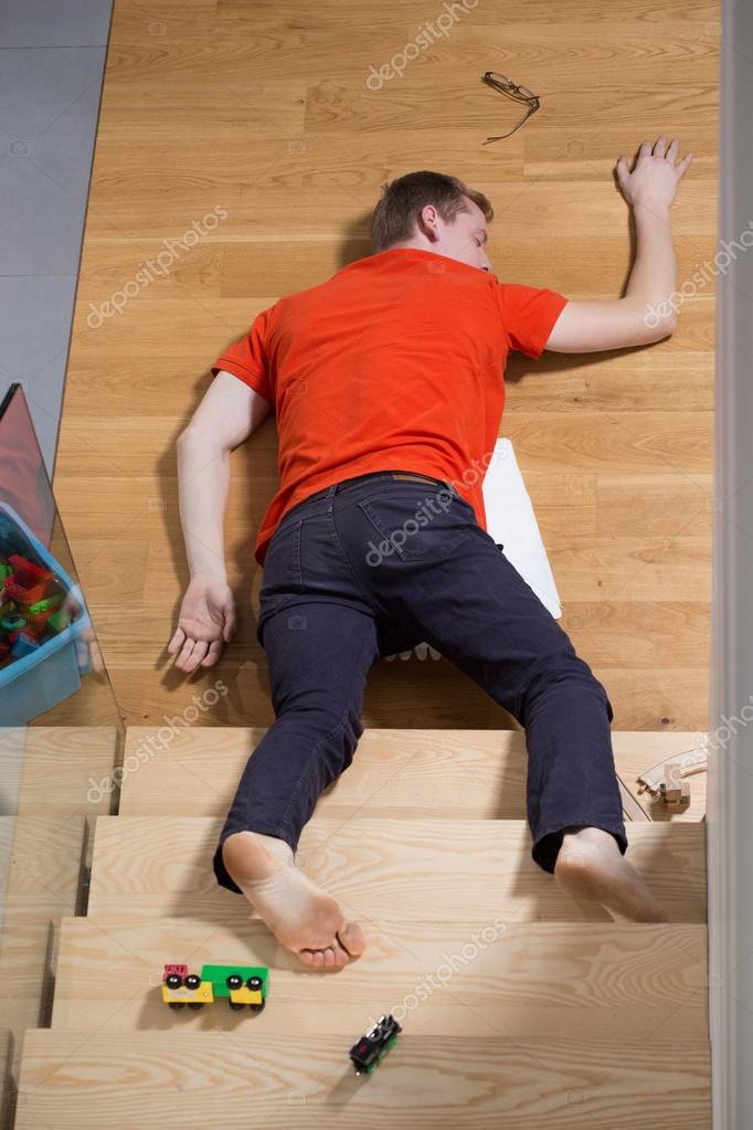 Man stepping on toys on stairs Stock Photo by ©photographee.eu 70624847
