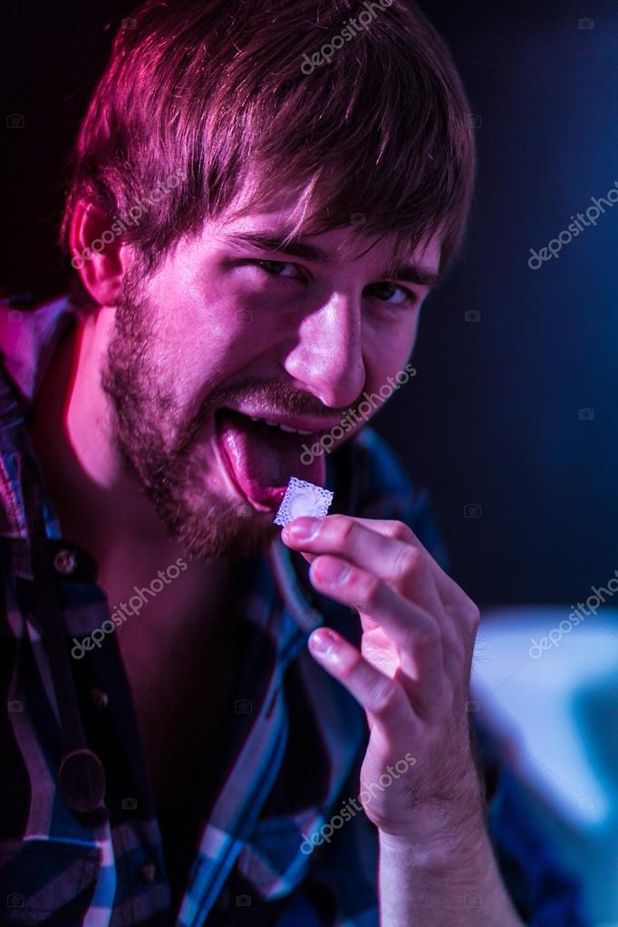 Man taking LSD — Stock Photo © photographee.eu #71057403