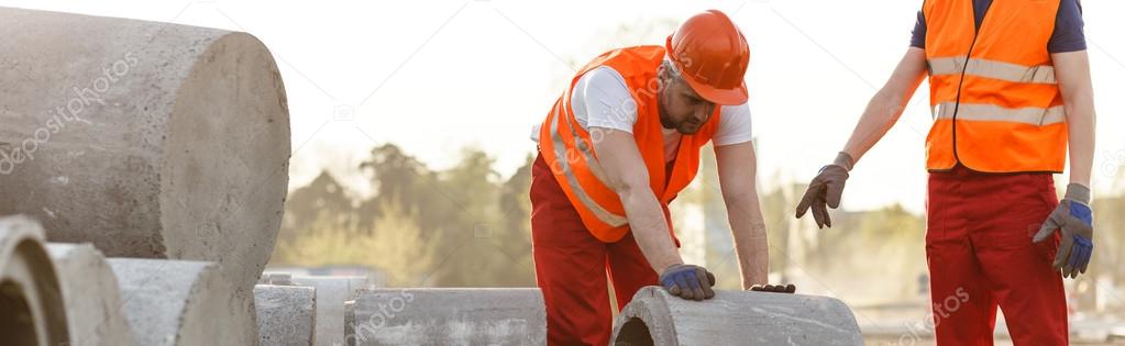 Construction workers rolling concrete circle Stock Photo by ...