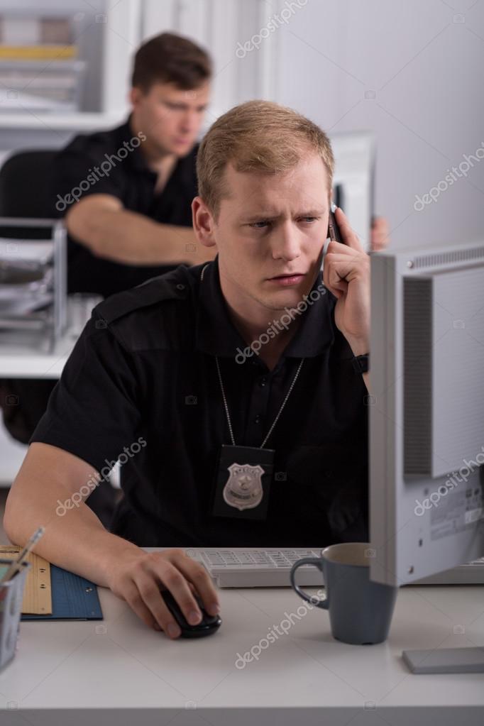 Man working on police helpline — Stock Photo © photographee.eu #80188634