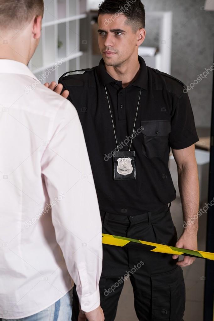 Policeman at the crime scene — Stock Photo © photographee.eu #81167322