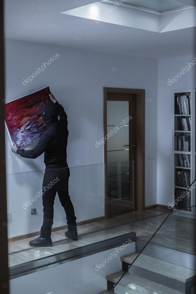 Robber stealing invaluable piece of art — Stock Photo © photographee.eu ...