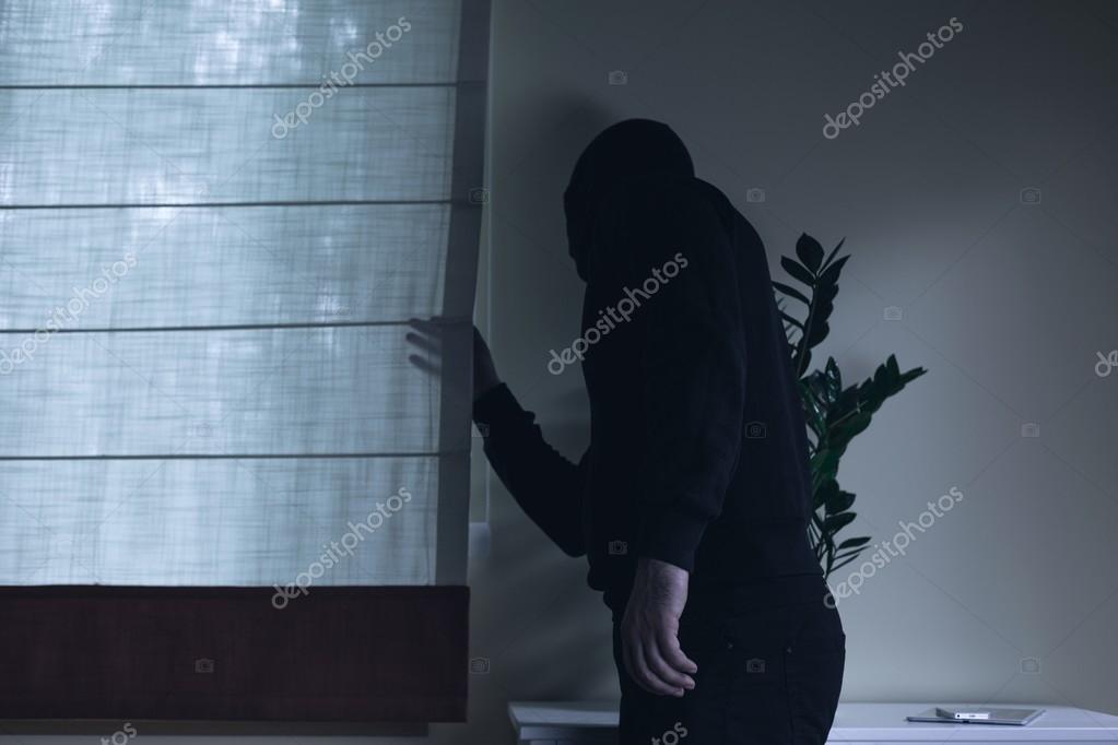 Housebreaker during night home invasion — Stock Photo © photographee.eu ...