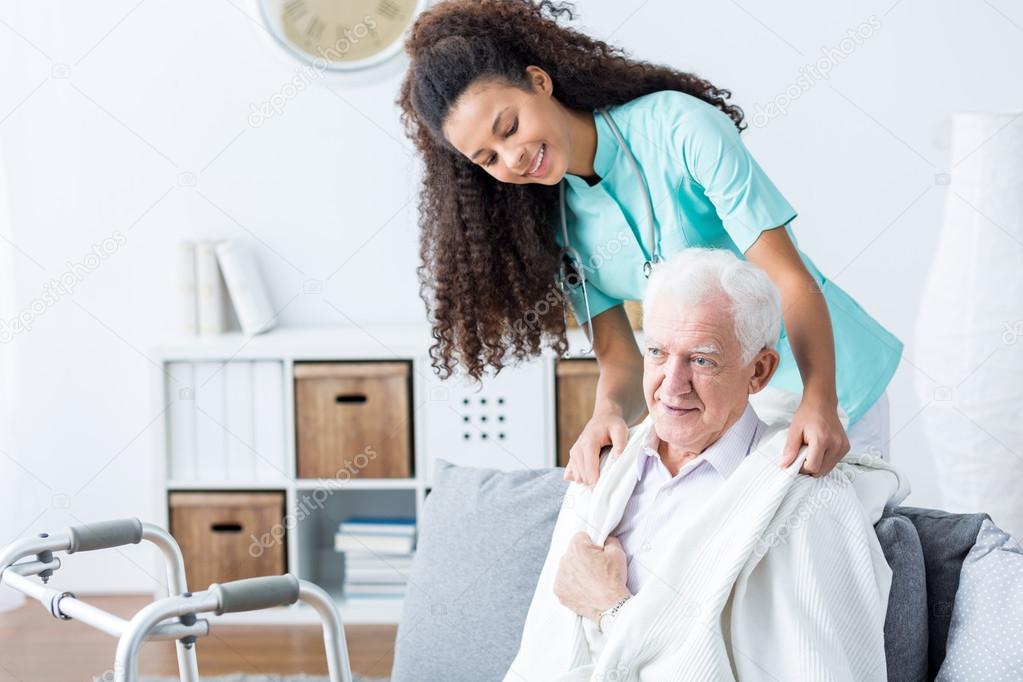 Doctor helping senior man — Stock Photo © photographee.eu #92359424