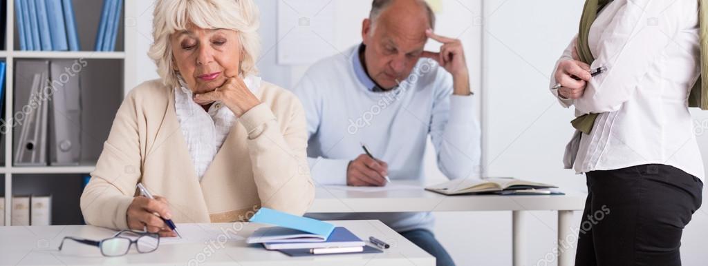 Mature students writing test Stock Photos, Royalty Free Mature students ...