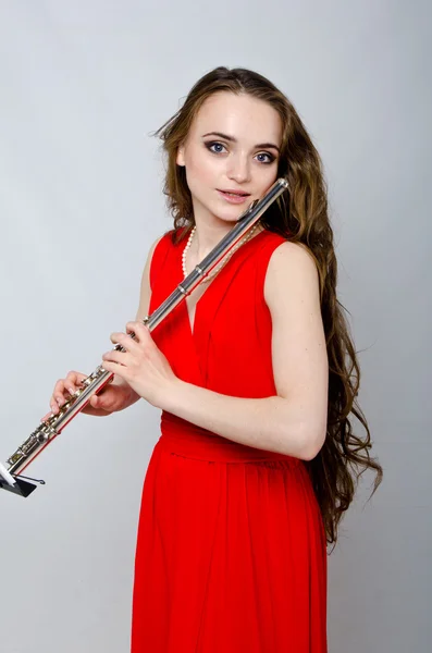 Girl with a flute Stock Photo by ©uminov 112384174