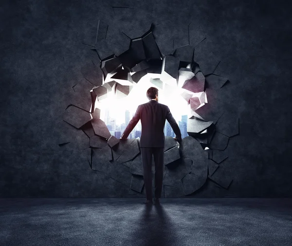 Breaking through wall Stock Photos, Royalty Free Breaking through wall ...