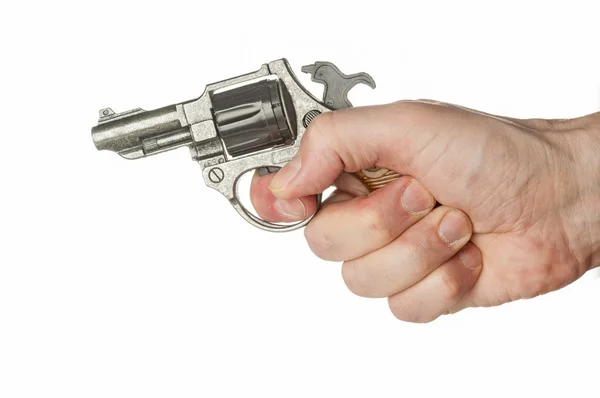 Metal toy gun in hand — Stock Photo © Evgenyjs1 #218126690