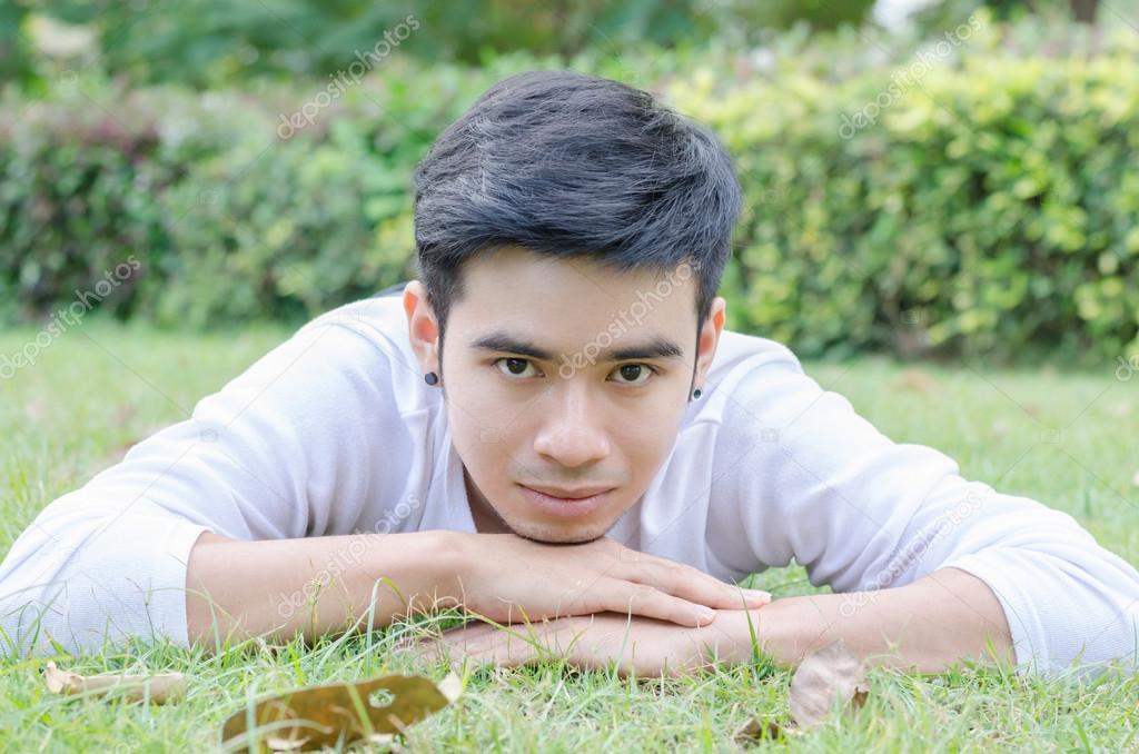 Portrait of handsome young man, outdoor — Stock Photo © khwanchais ...
